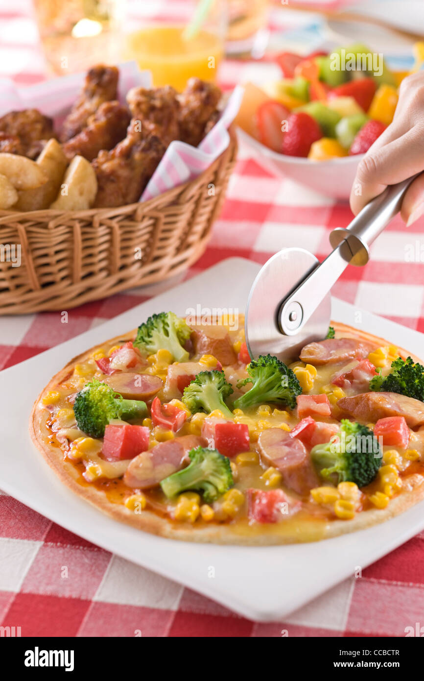 Holding pizza cutter hi-res stock photography and images - Alamy