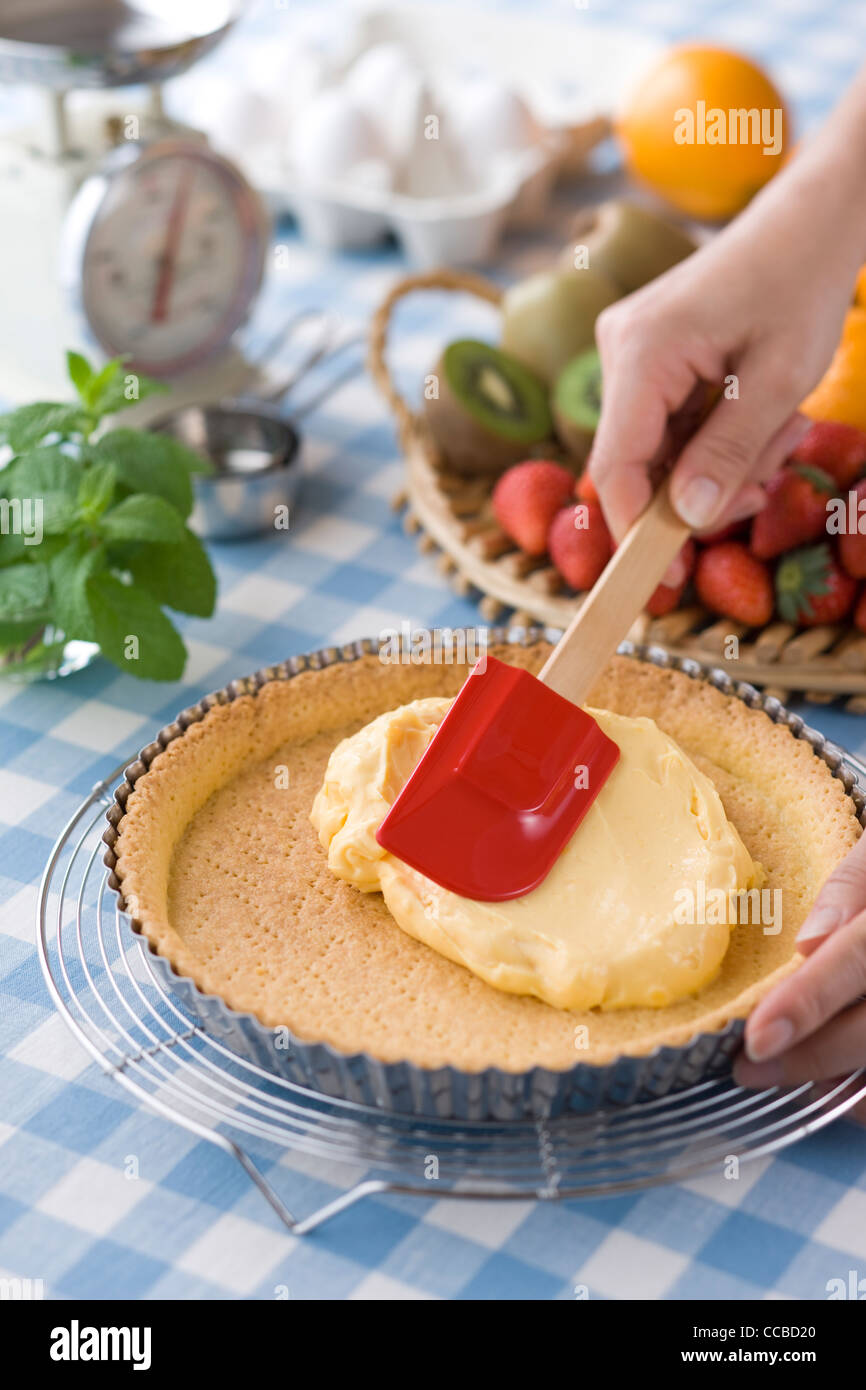 Human Hand Spreading Custard on Tart Stock Photo - Alamy