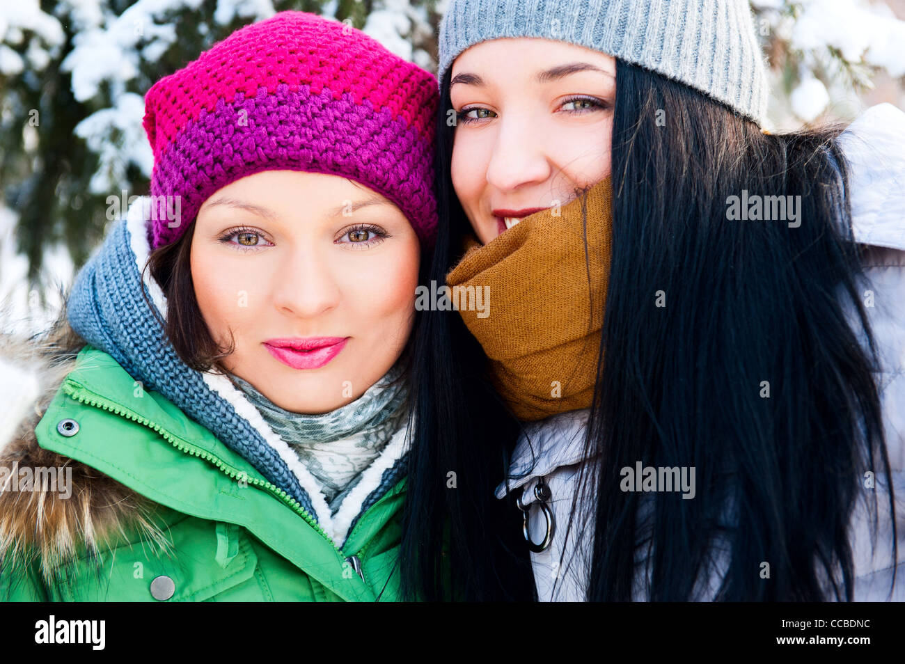 Two happy friends having fun in winter Stock Photo - Alamy