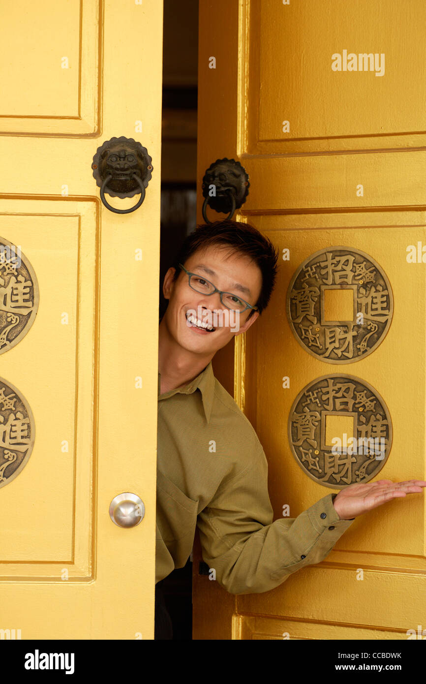 Person peeking out of door hi-res stock photography and images - Alamy