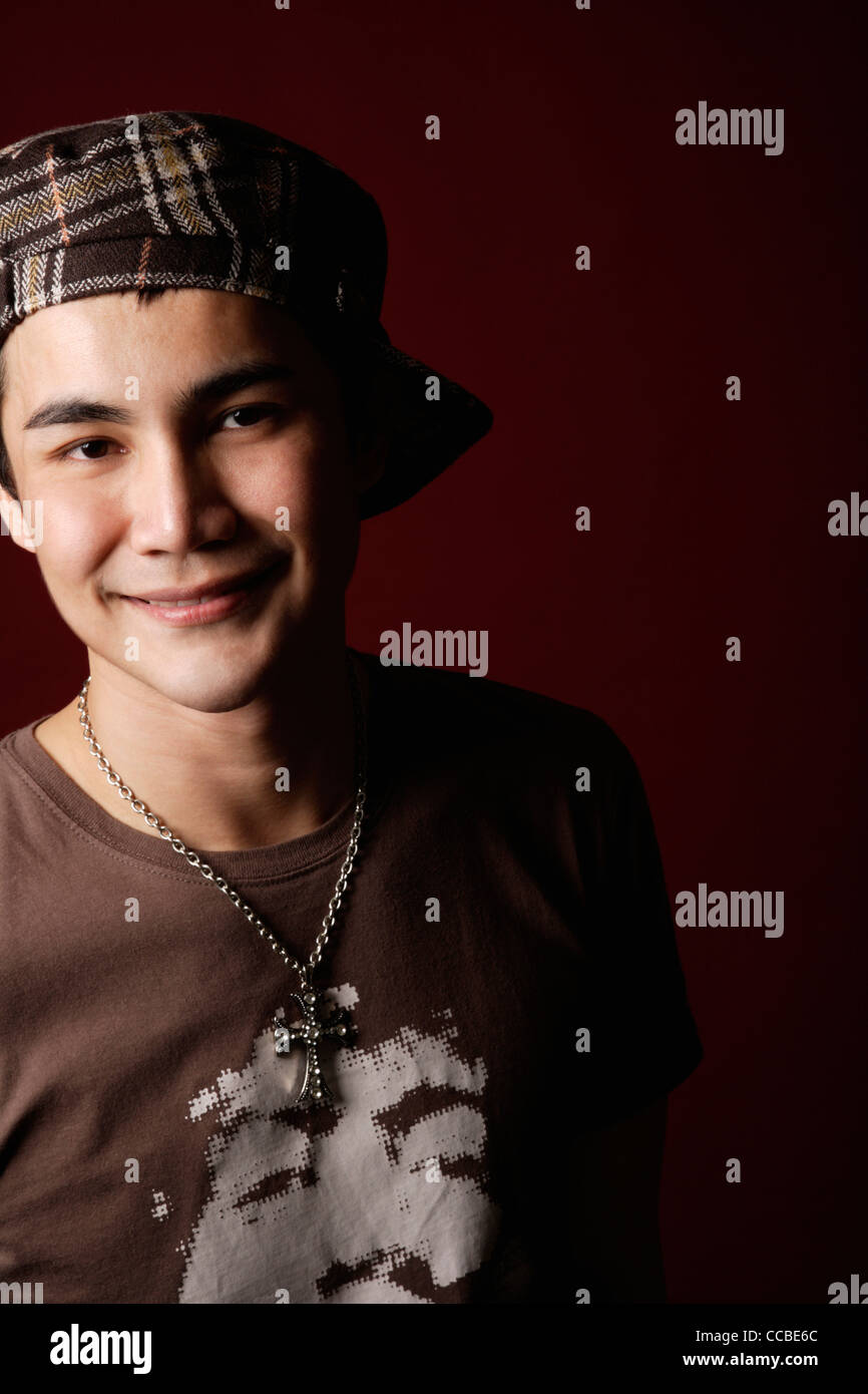 young man in hat smiling at camera Stock Photo - Alamy