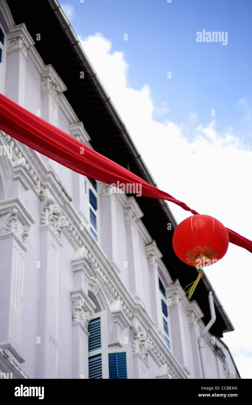 red lantern tied to red ribbon in front of building Stock Photo - Alamy