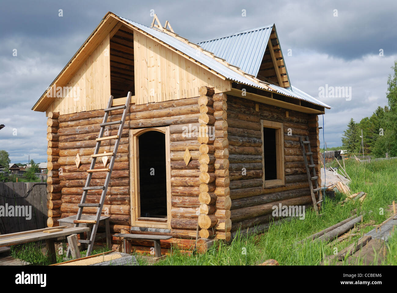 small unfinished wooden timber home in russian country Stock Photo - Alamy