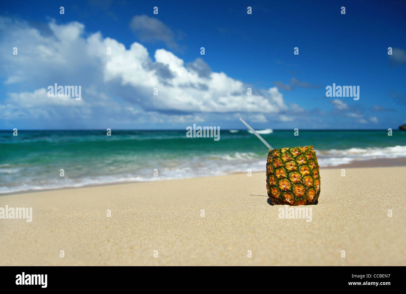 Exotic cocktail with pipe on caribbean beach Stock Photo - Alamy