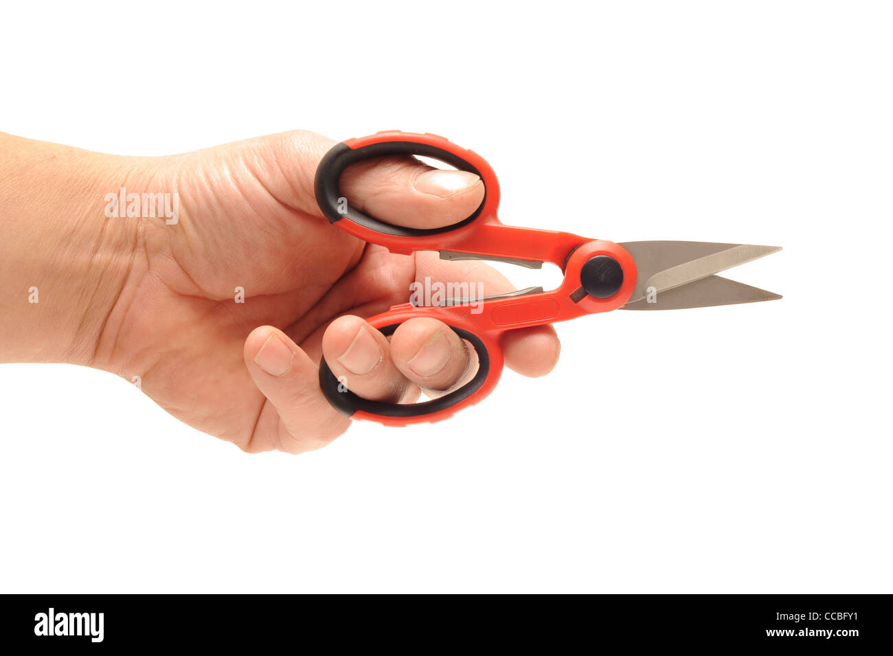 a pair of scissors being used by a human hand Stock Photo - Alamy
