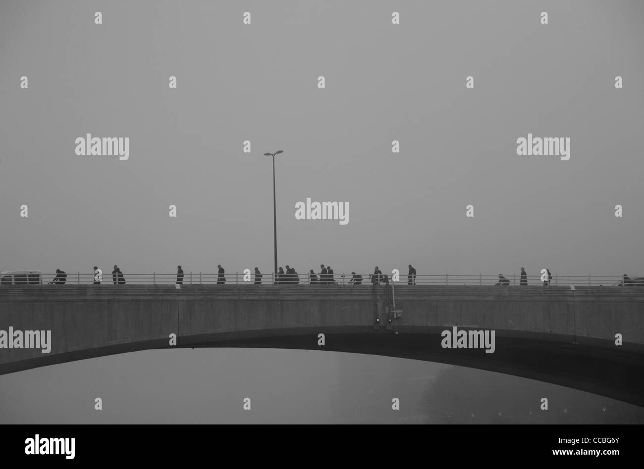 Misty view of commuters walking across Waterloo Bridge, South Bank ...