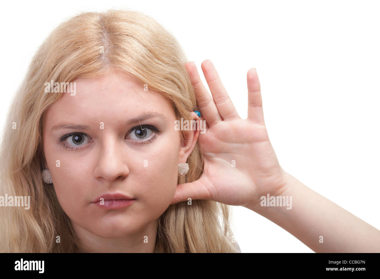 Business woman eavesdropping with hand behind her ear Stock Photo - Alamy