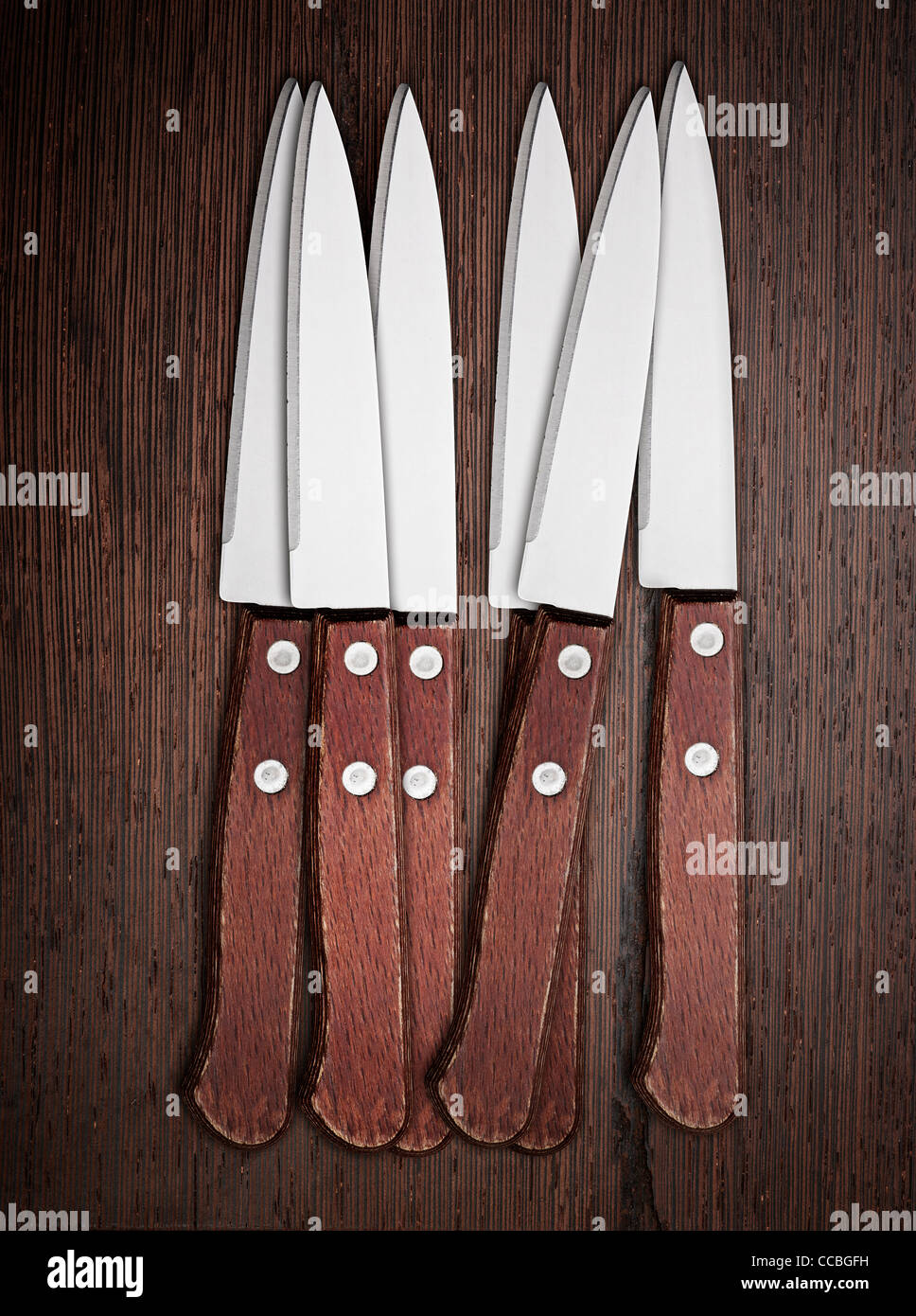 Knife on rustic kitchen table Stock Photo - Alamy