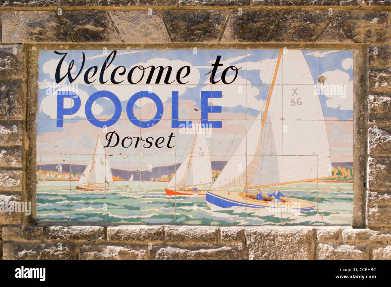 Sign 'Welcome to Poole, Dorset', England, made of tiles showing a sea ...
