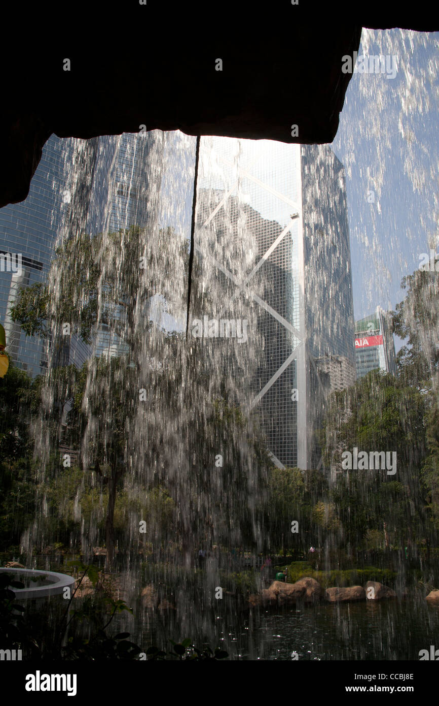 Bank of China Tower building seen through the waterfall in Hong Kong ...
