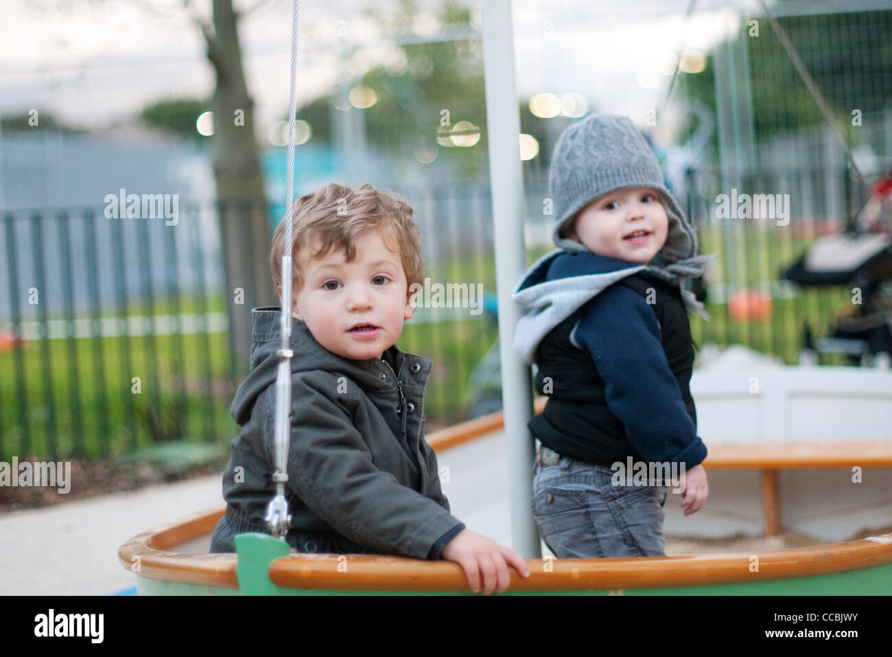 Toddler boys playing on playground Stock Photo - Alamy