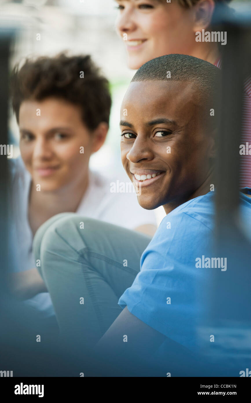 Young man hanging out with friends Stock Photo - Alamy