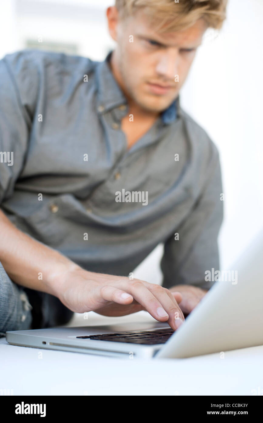 Man using laptop computer Stock Photo - Alamy
