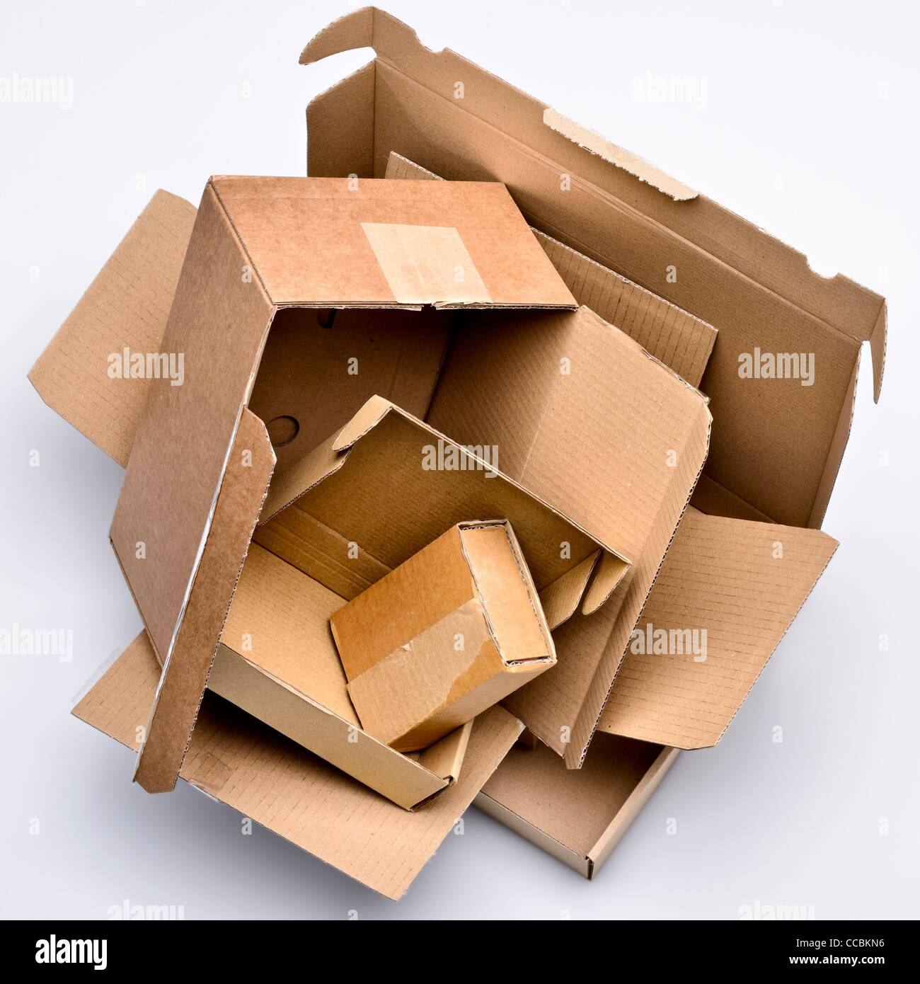 Pile of brown cardboard boxes stacked Stock Photo - Alamy