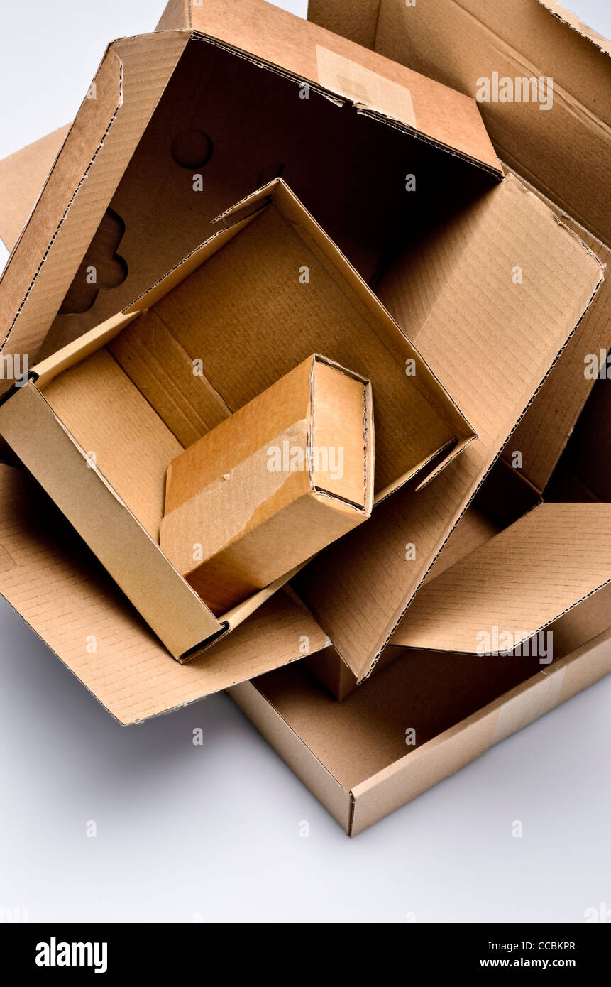 Open cardboard boxes stacked Stock Photo - Alamy
