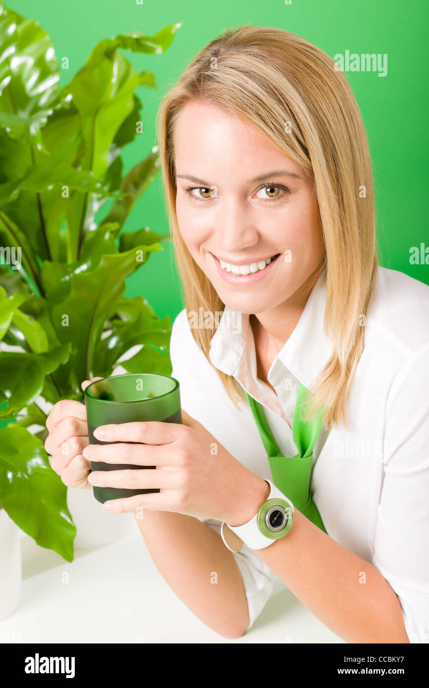 Green business office woman drink coffee plant environment friendly ...
