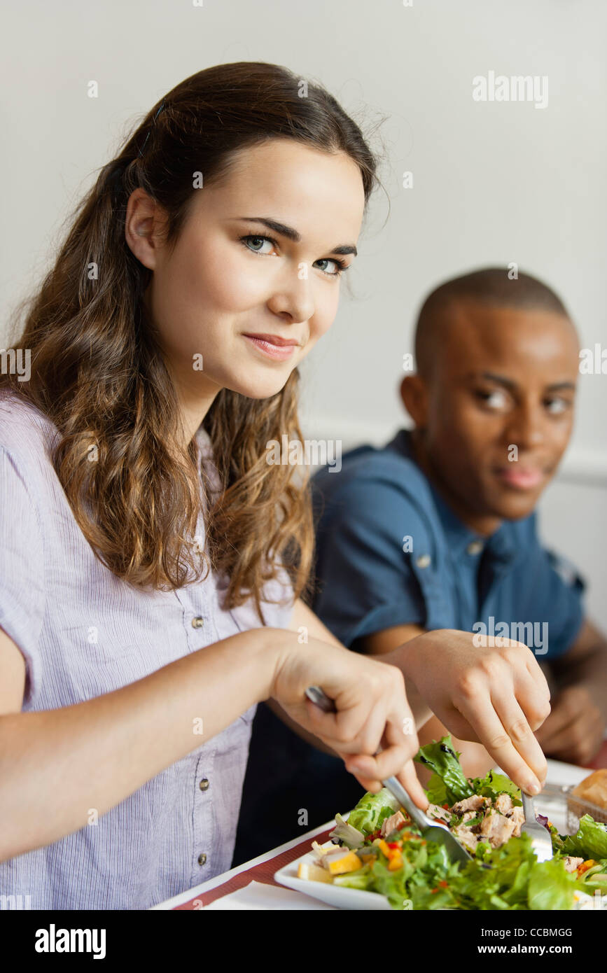 Young woman dining in restaurant Stock Photo - Alamy