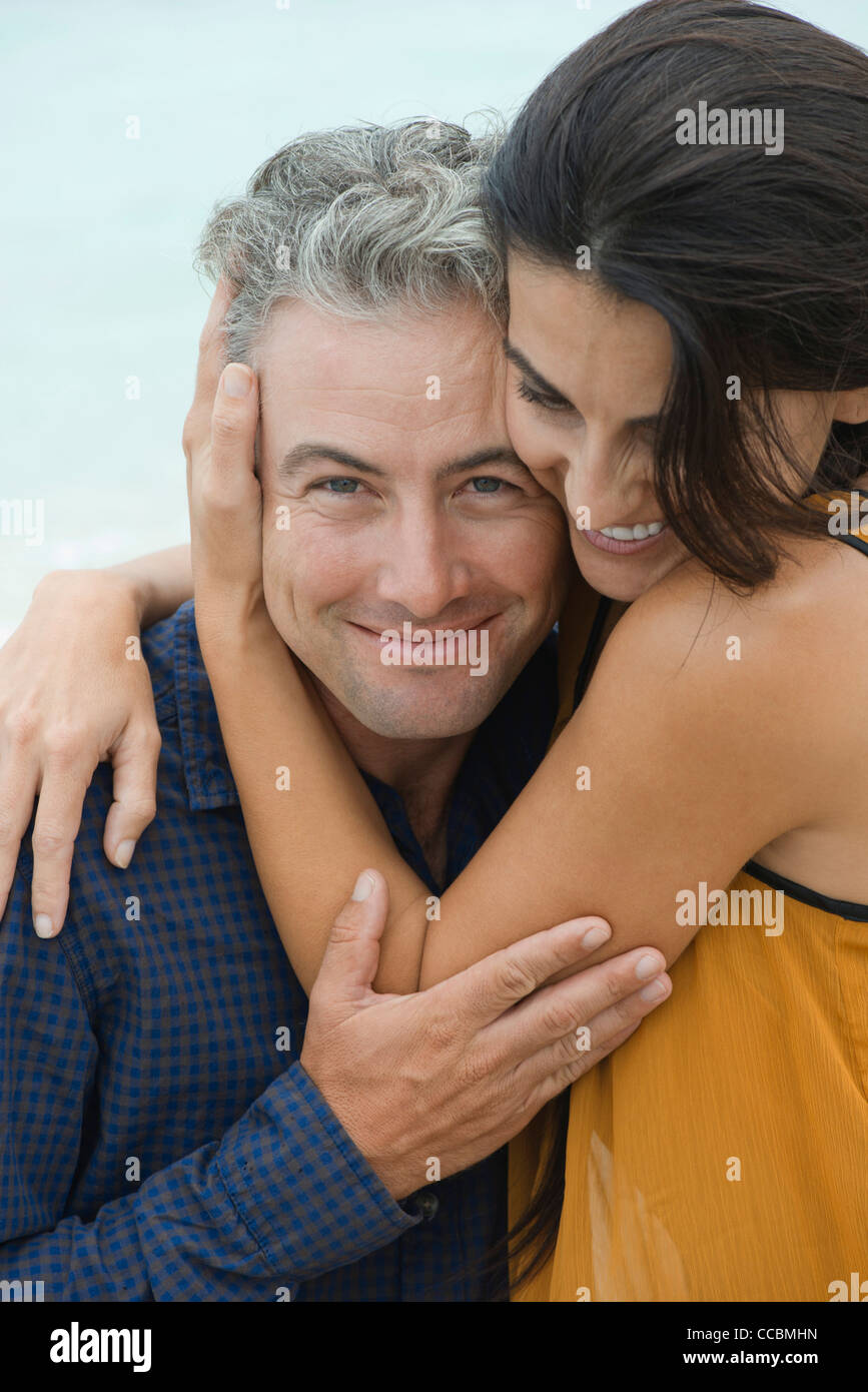 Woman wrapping arms around husband hi-res stock photography and images ...