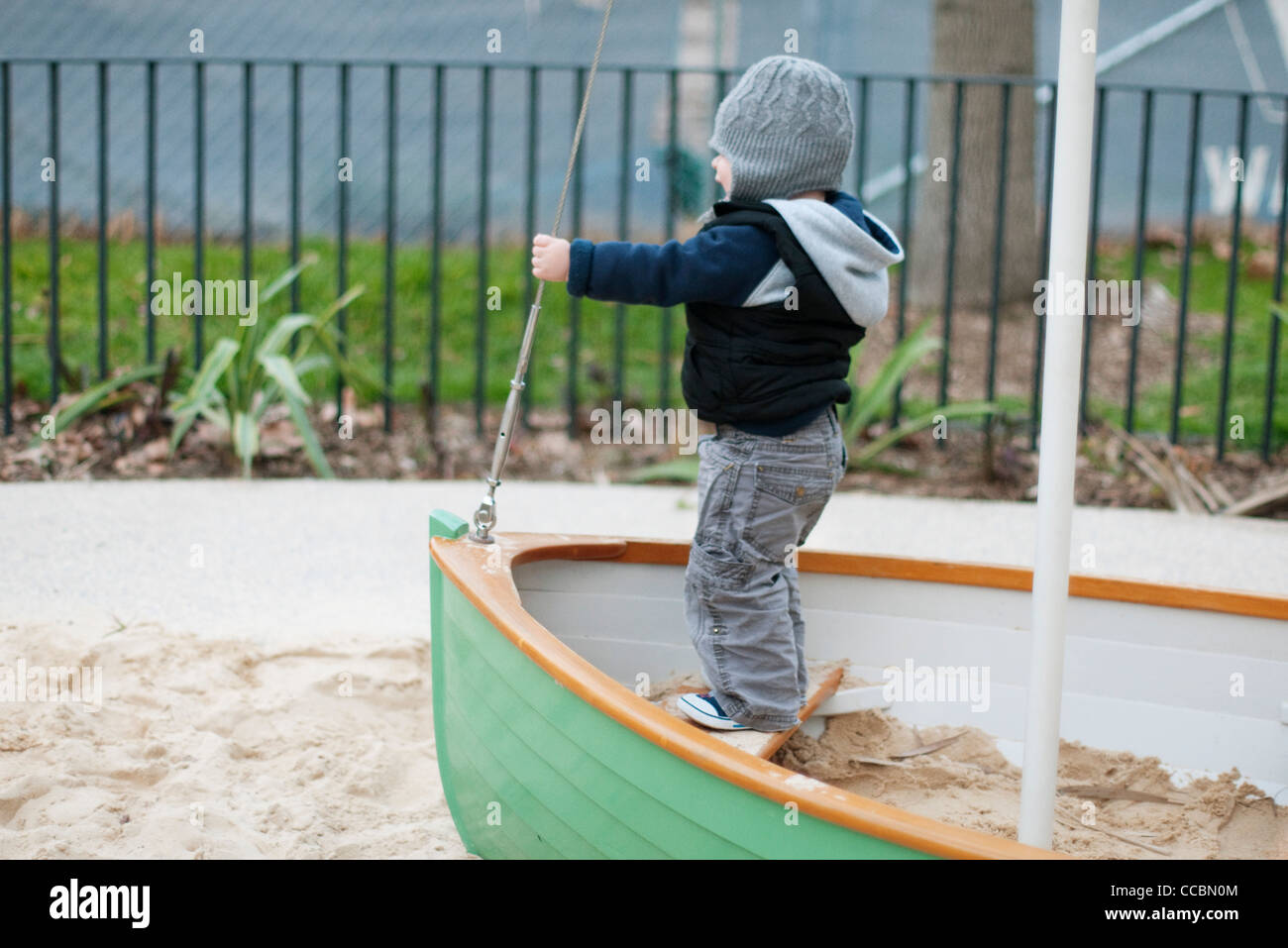 Toddler playing on boat Stock Photo - Alamy