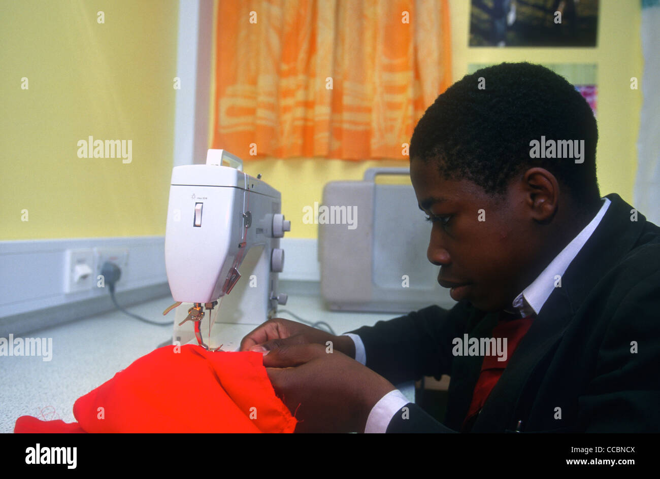 Secondary school pupil in textiles class, Southwark, London, UK Stock ...