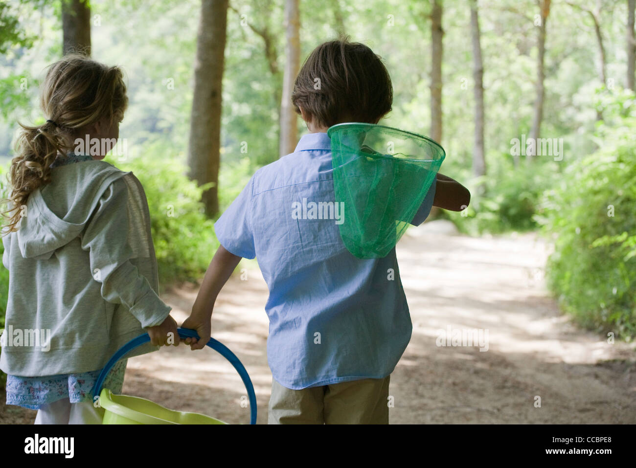Two boys carrying bucket hi-res stock photography and images - Alamy