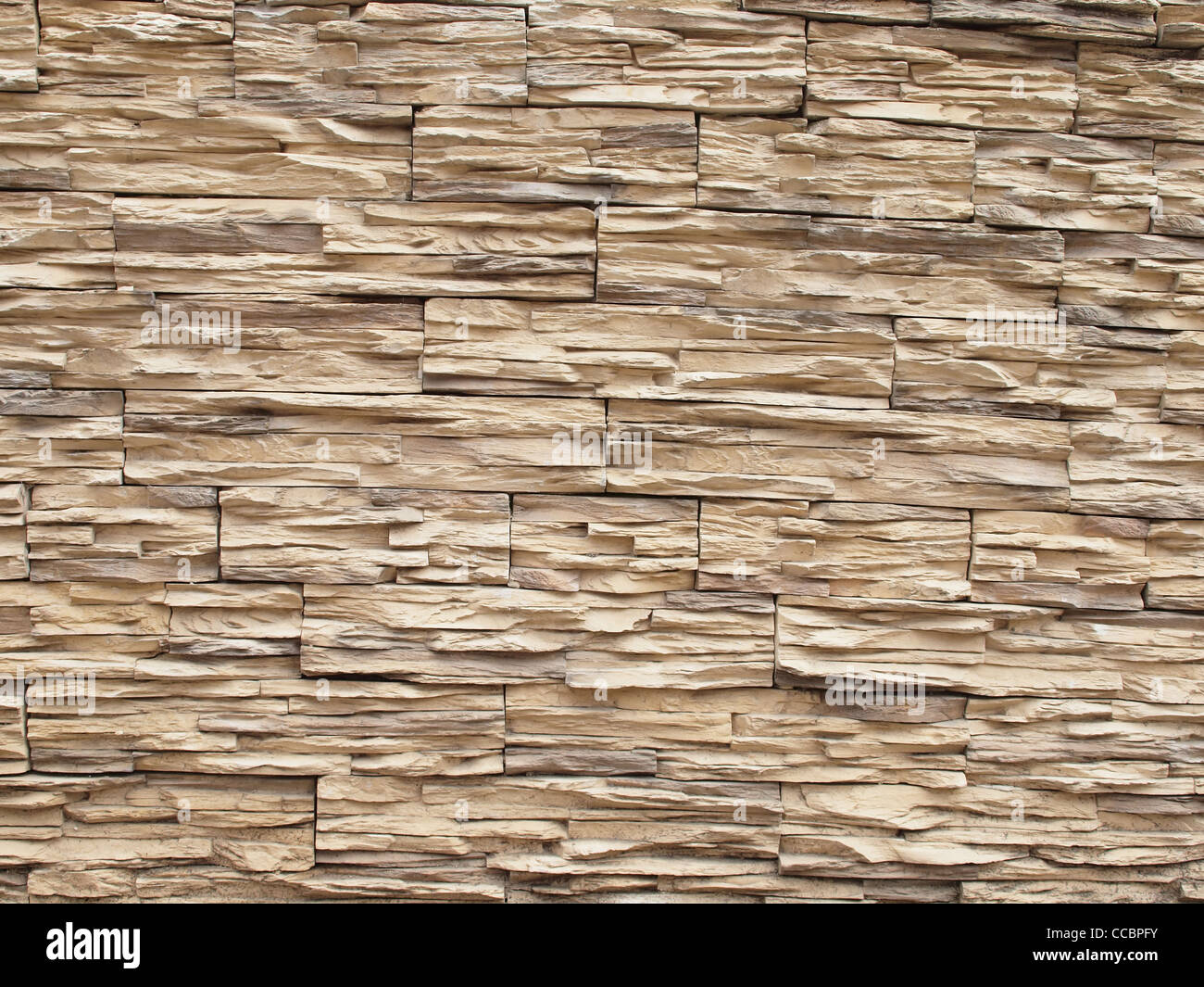 wall covered with light stone ribbed texture Stock Photo - Alamy