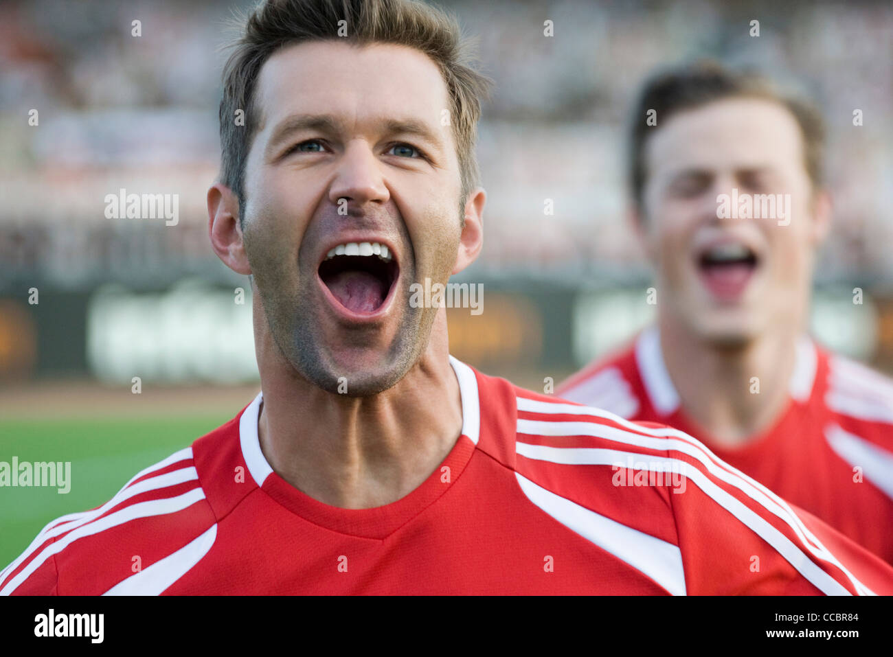 Soccer players shouting in victory Stock Photo - Alamy