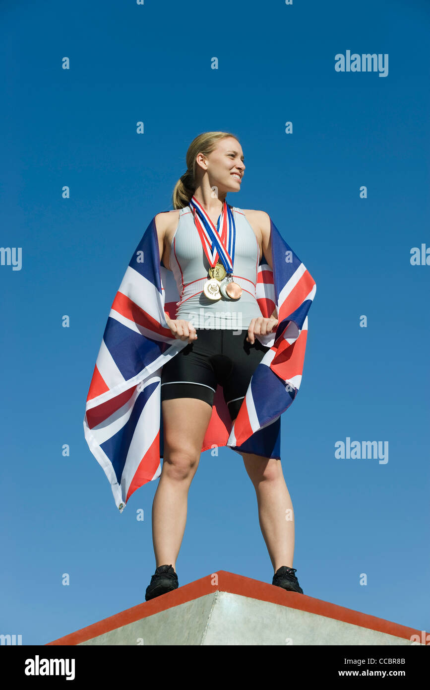 Female athlete being honored on podium Stock Photo - Alamy