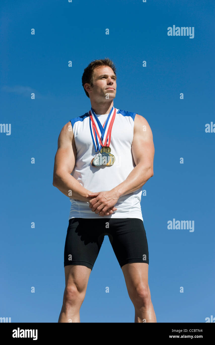 Male athlete on winner's podium Stock Photo - Alamy