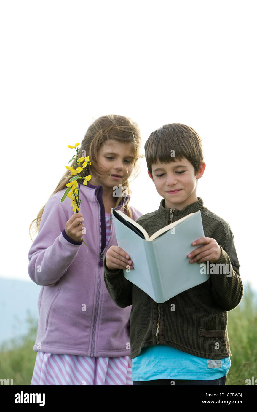 Boy girl reading books outside hi-res stock photography and images - Alamy