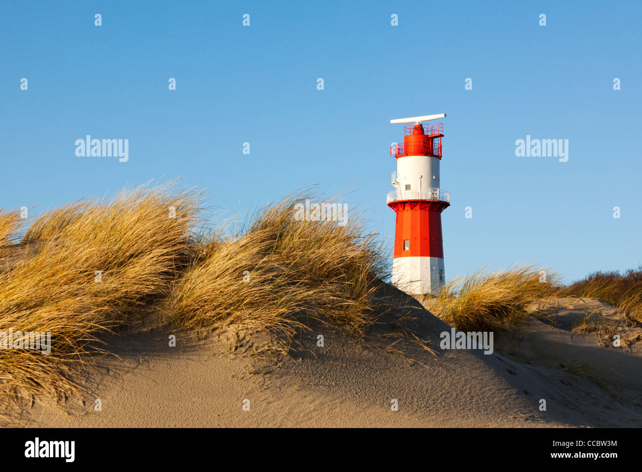 small lighthouse in the dunes at Borkum island Stock Photo - Alamy
