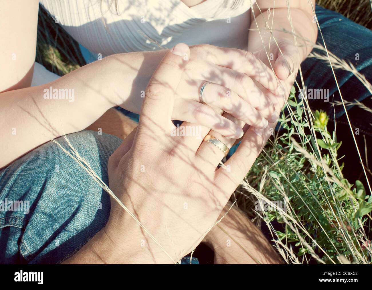 Couple holding hands, cropped Stock Photo - Alamy
