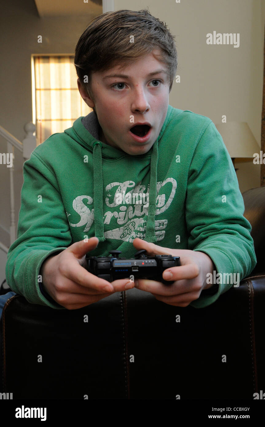 Teenage Boy Playing A Computer Game Stock Photo - Alamy