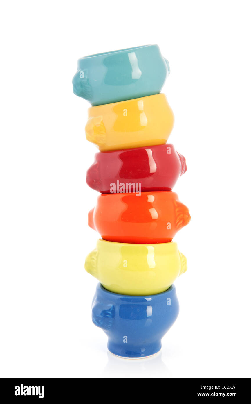 Stack of colorful soup cups isolated over white background Stock Photo ...