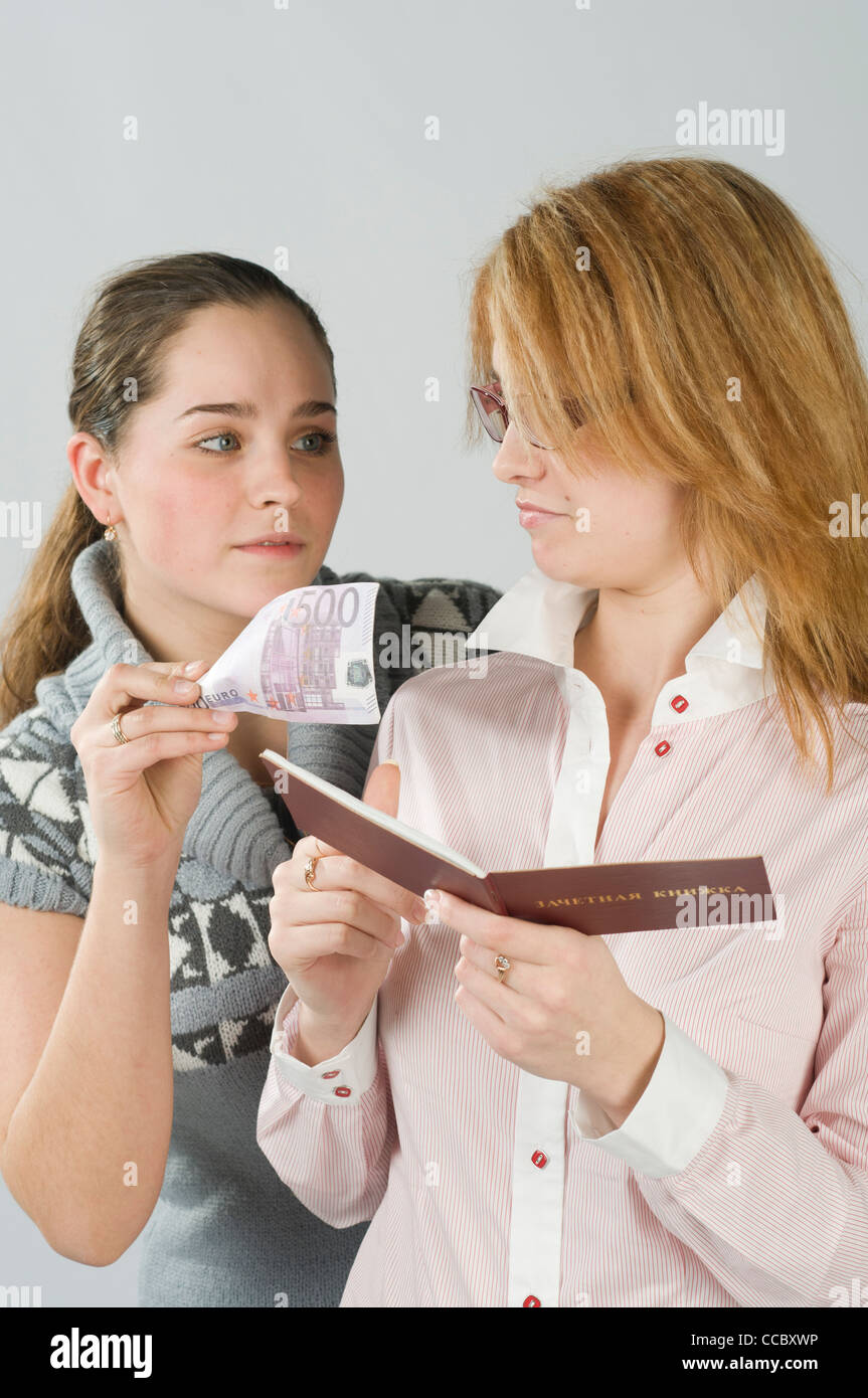 Young student gives teacher a 500 euro bribe to pass her exams Stock ...