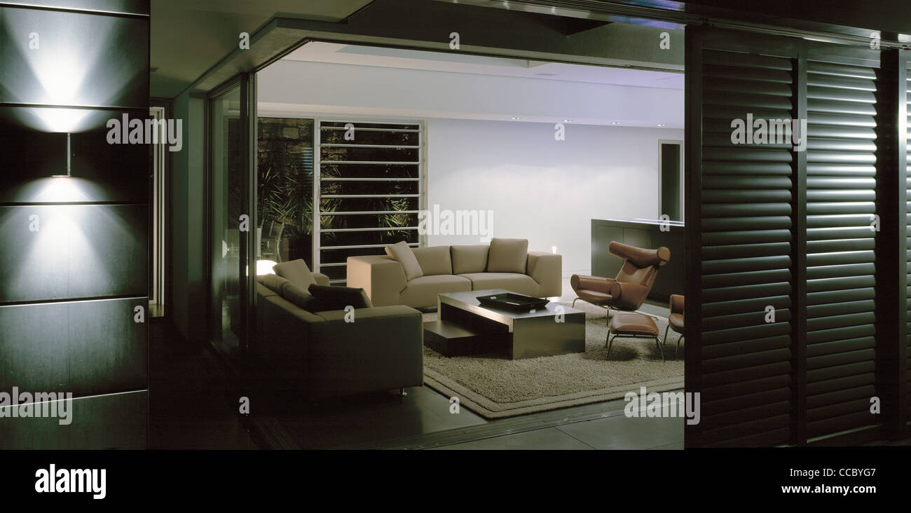 PRIVATE HOUSE LIVING SPACE VIEWED FROM TERRACE AT NIGHT Stock Photo - Alamy