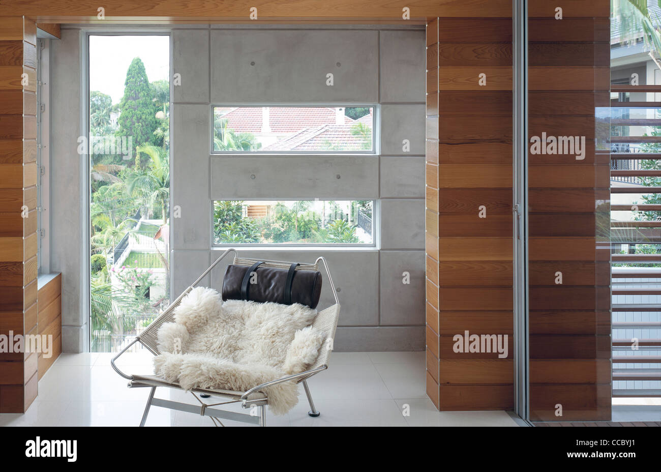 PRIVATE HOUSE LIVING ROOM DETAIL: CONCRETE APERTURES, TIMBER+CHAIR ...