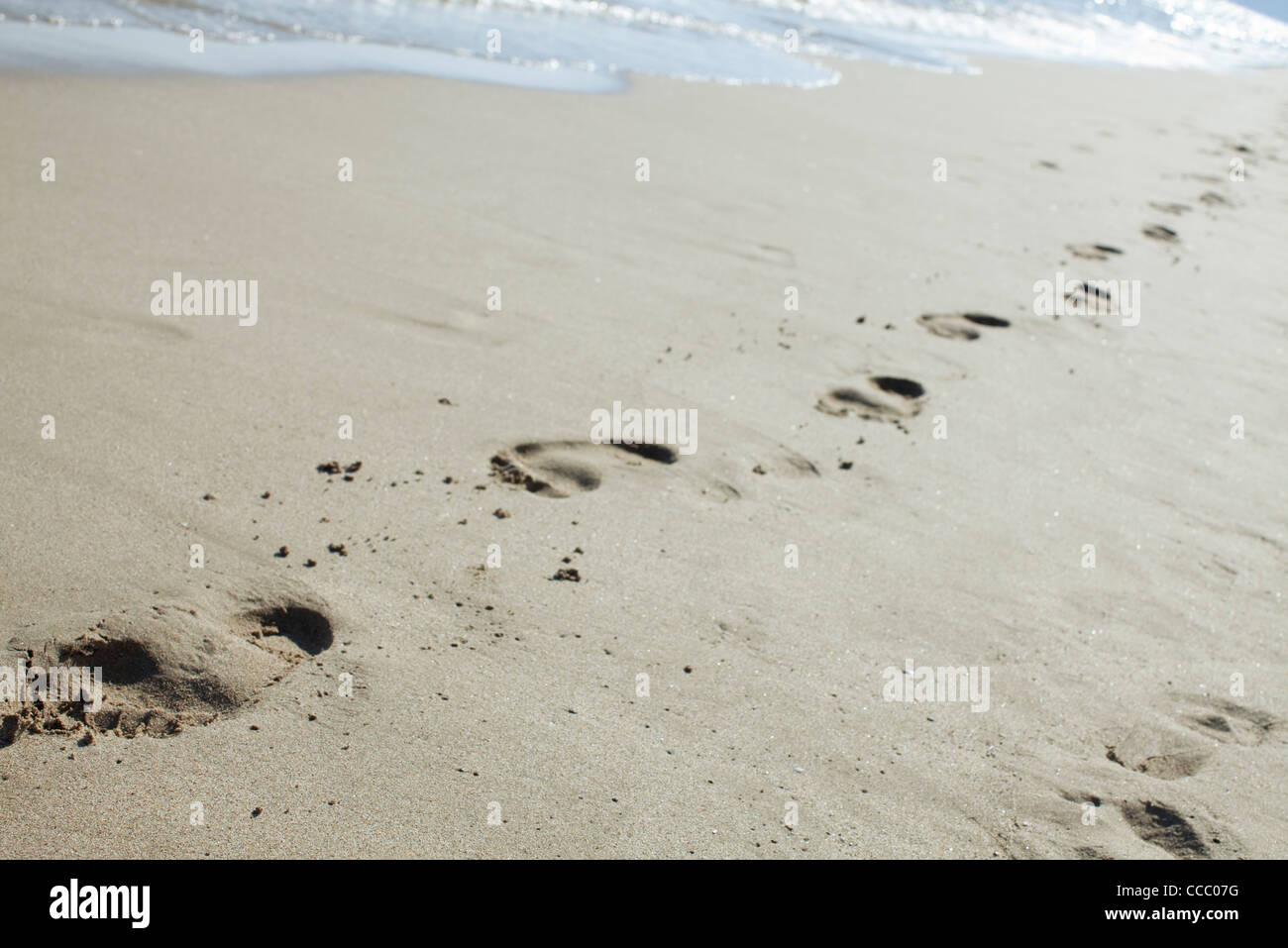 Footprints in sand at the beach Stock Photo - Alamy