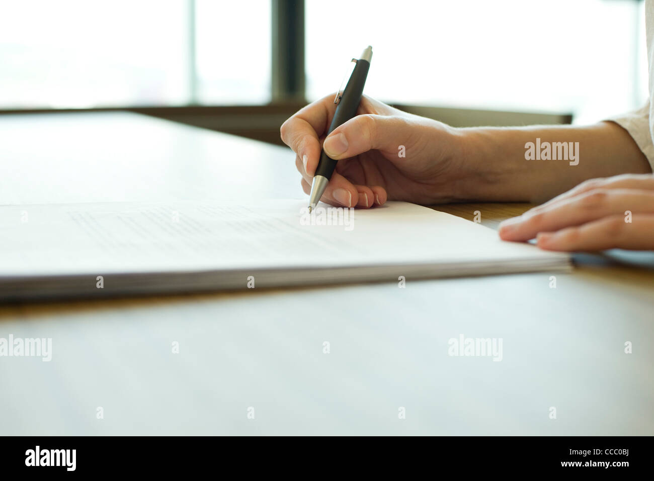 Person signing document, cropped Stock Photo - Alamy