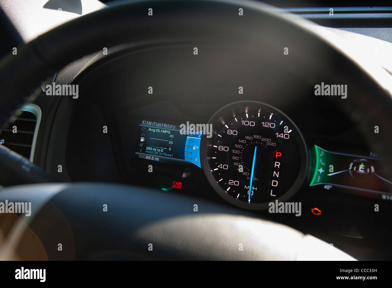 Instrument cluster with tachometer and fuel efficiency display in ...