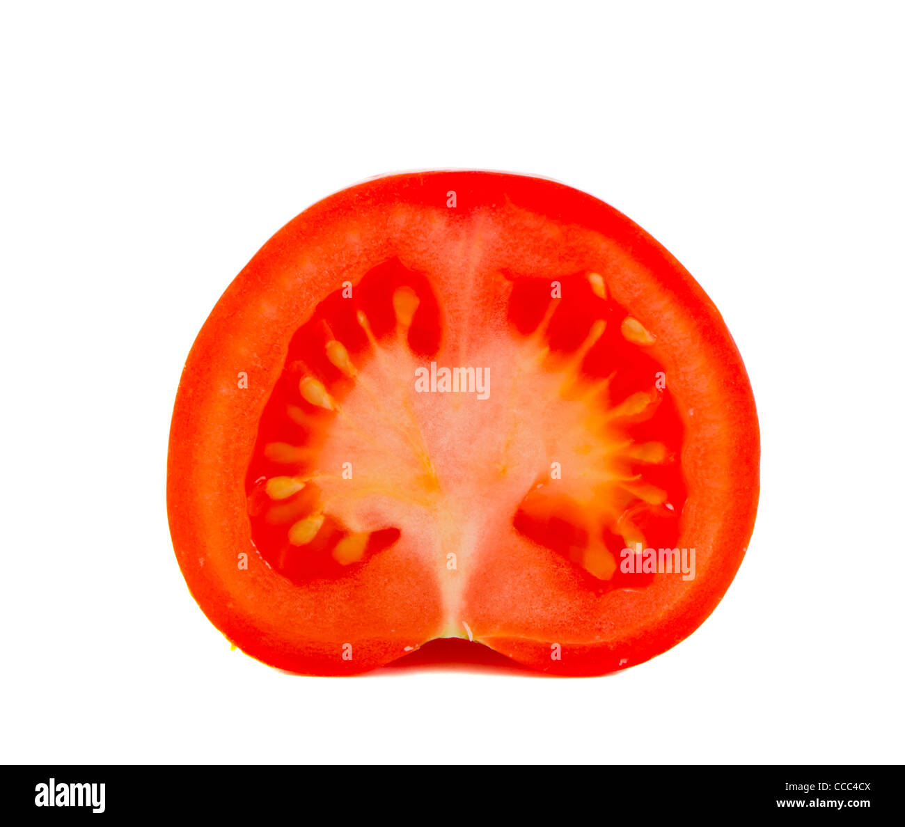 Half of cut tomato vegetable closeup isolated on white background ...