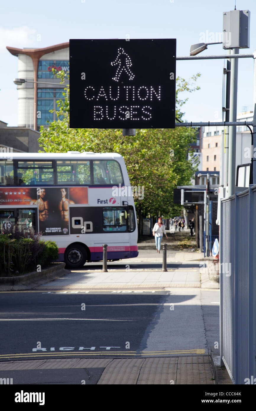 Bus Warning Sign to pedestrians, UK Stock Photo - Alamy