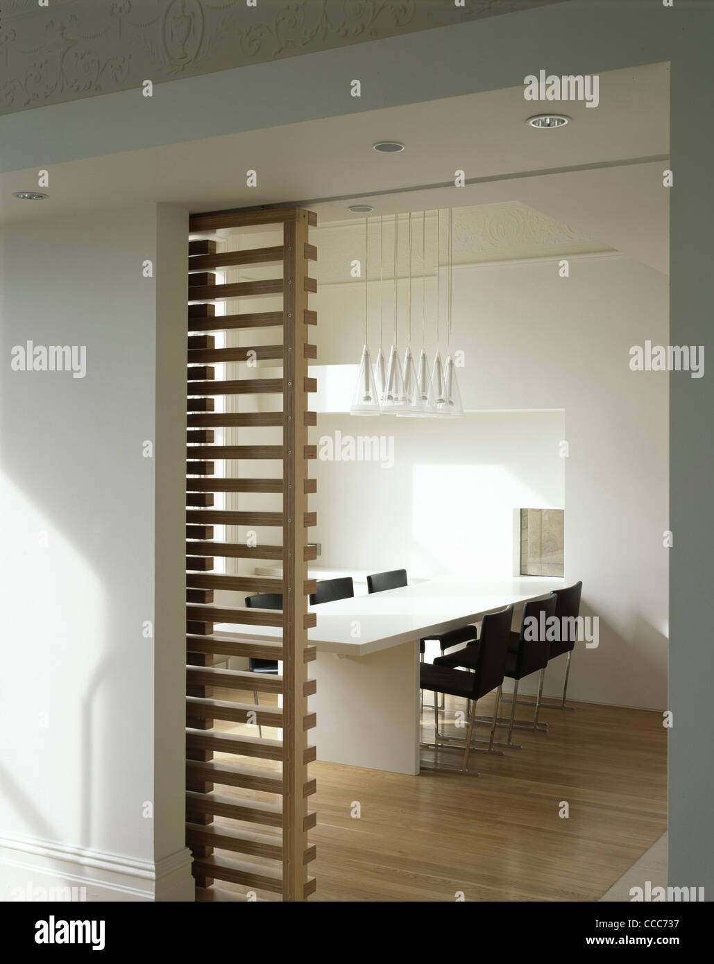 private house extension dining room from lounge with plywood screen ...