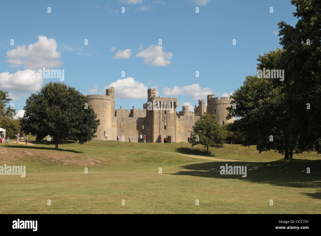 Distant view through trees towards the impressive 14th Century Bodiam ...
