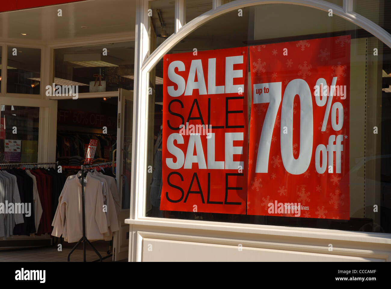 Sale sign in shop window, 70% off, England Stock Photo - Alamy