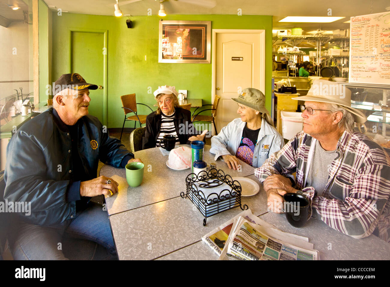 Local people their enjoy morning coffee and conversation at a Main ...