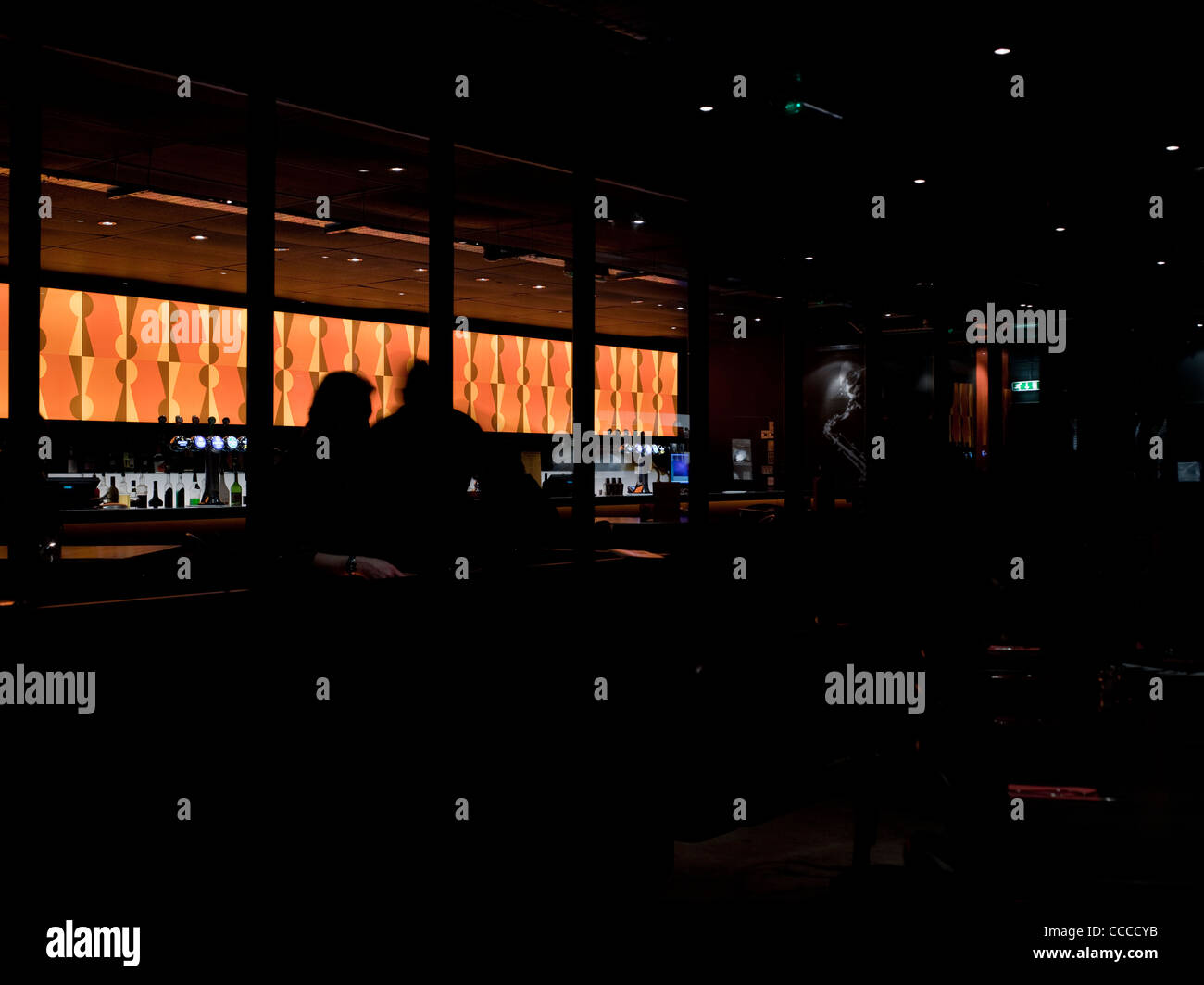 people moving in front of bar screen Stock Photo - Alamy