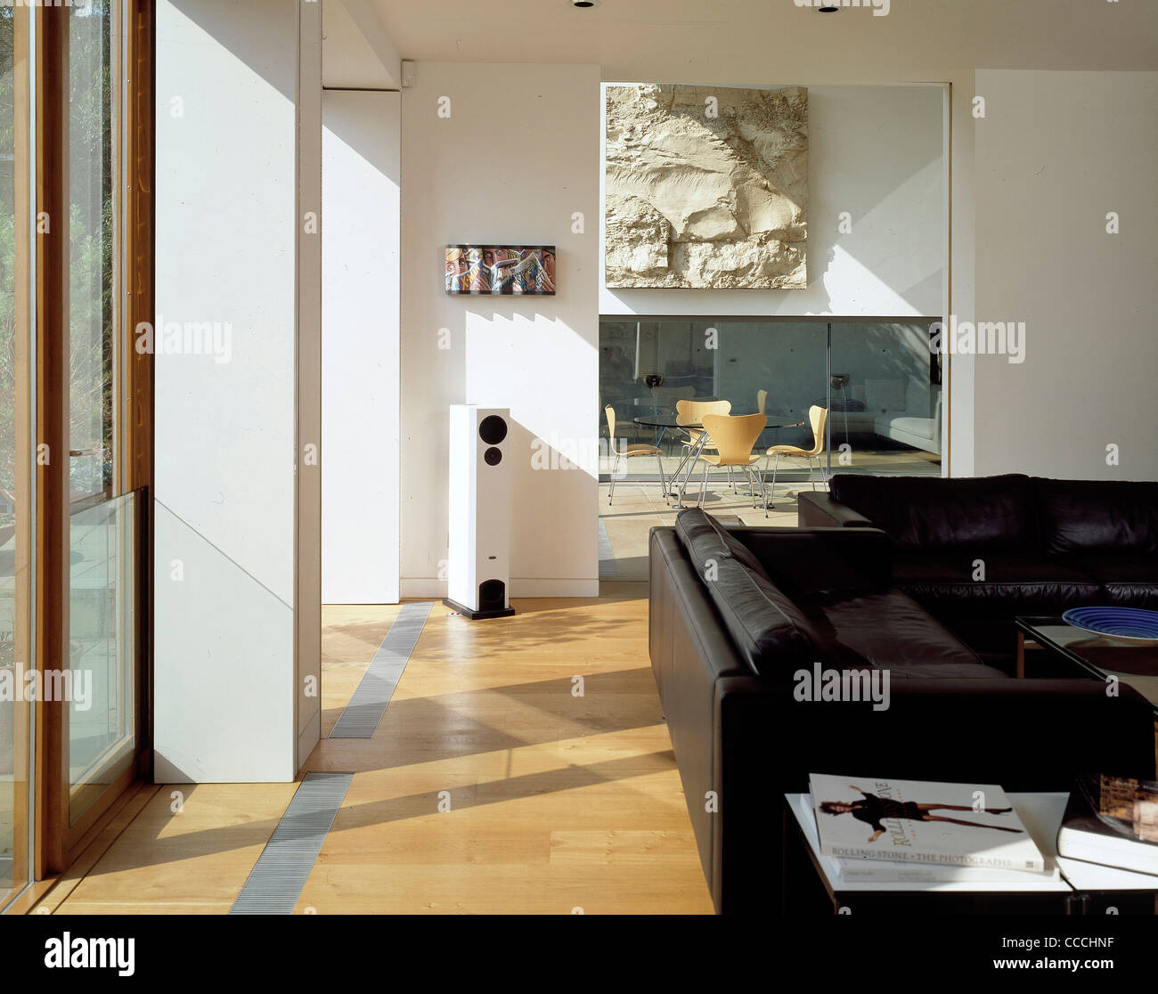 PRIVATE HOUSE VIEW OF SITTING ROOM WITH VIEWS TOWARDS ART WORK Stock ...