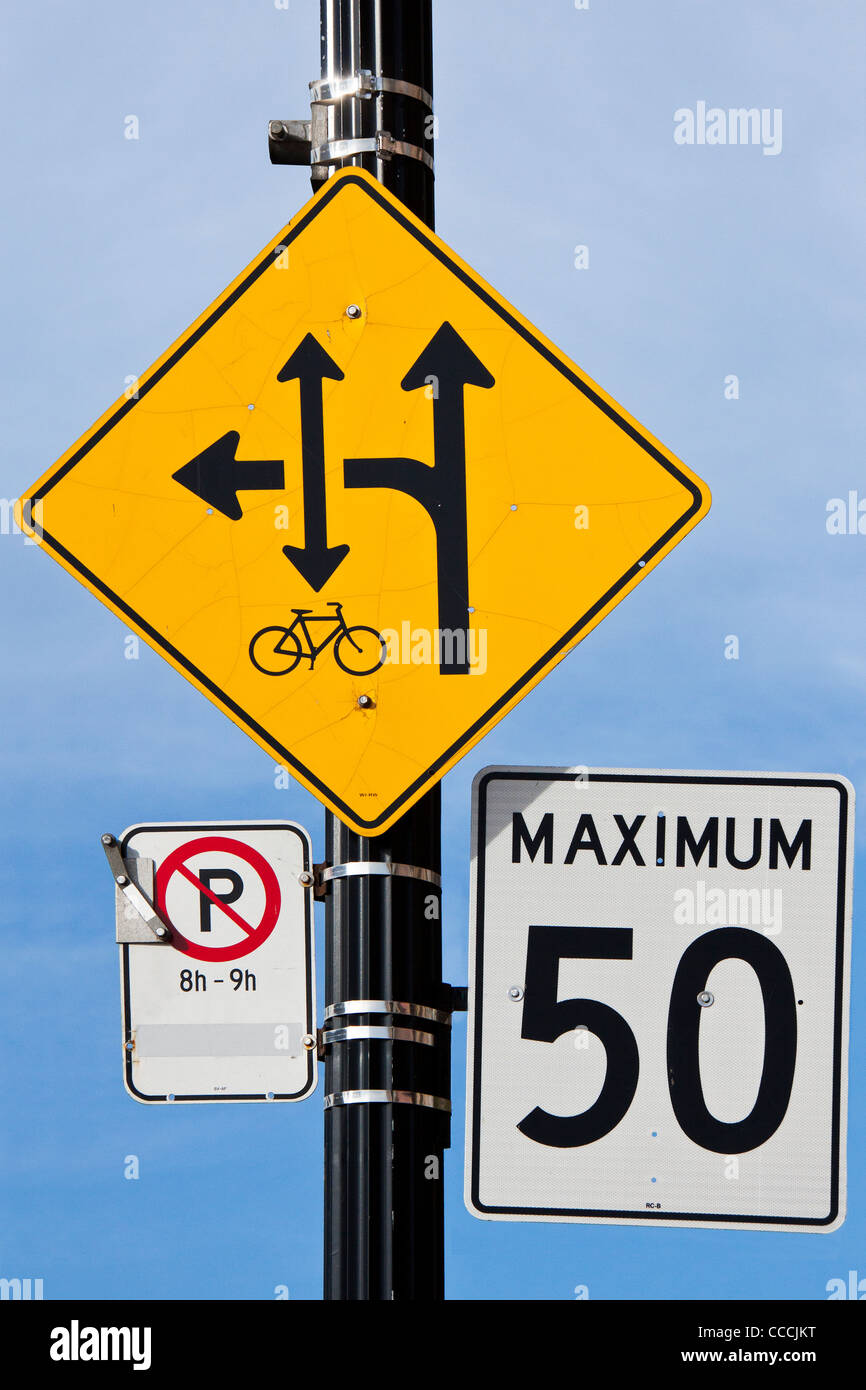 A speed limit sign, a forbidden parking one and intersection with ...