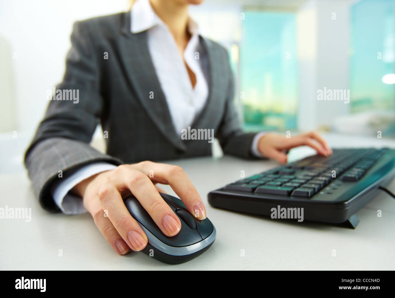 Image of female hands pushing keys of a computer mouse and keyboard ...